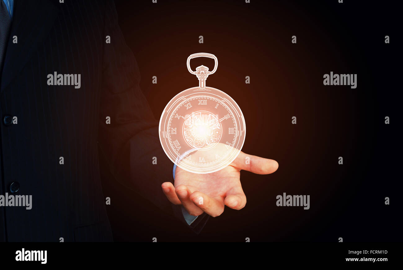 Close up of businessman hand showing pocket watch symbol Stock Photo ...