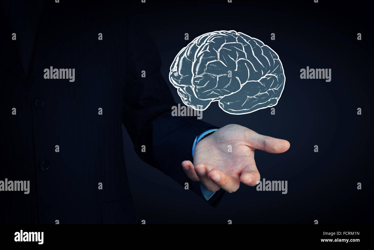 Close up of businessman hand holding brain in palm Stock Photo - Alamy