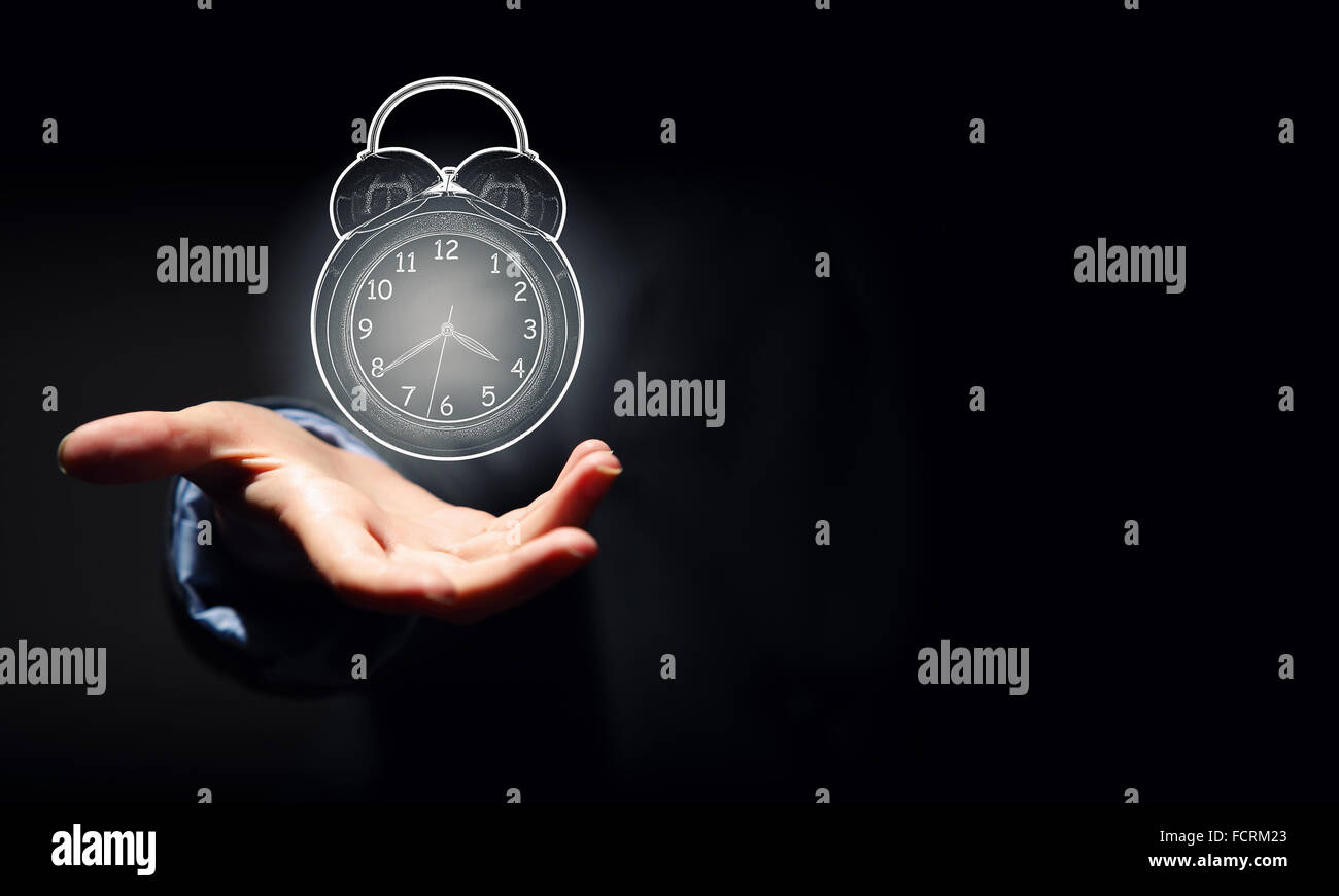 Close up of businessman hand showing clock watch symbol Stock Photo - Alamy