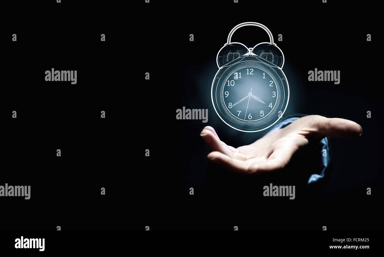 Close up of businessman hand showing clock watch symbol Stock Photo - Alamy