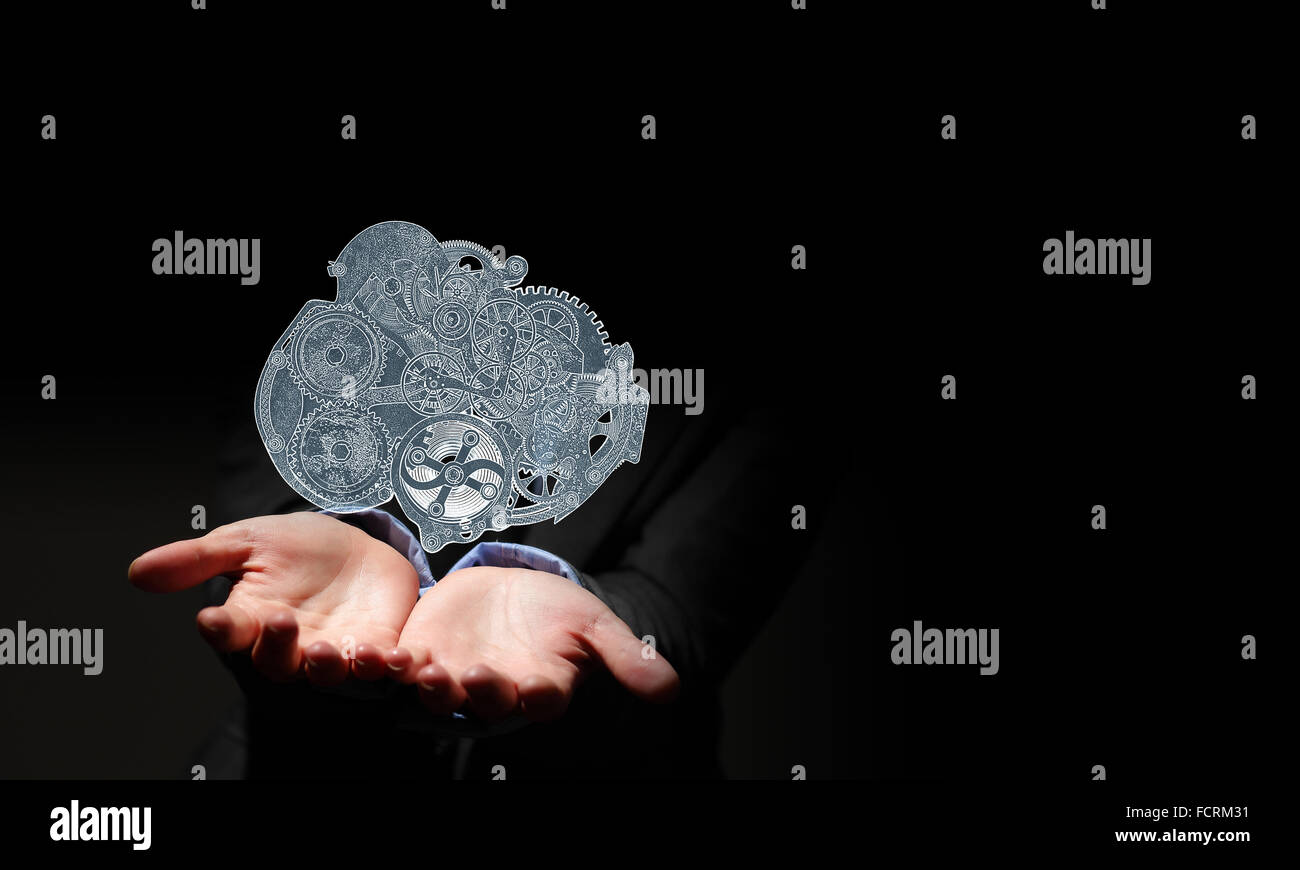 Close up human hand holding gears mechanism hi-res stock photography ...
