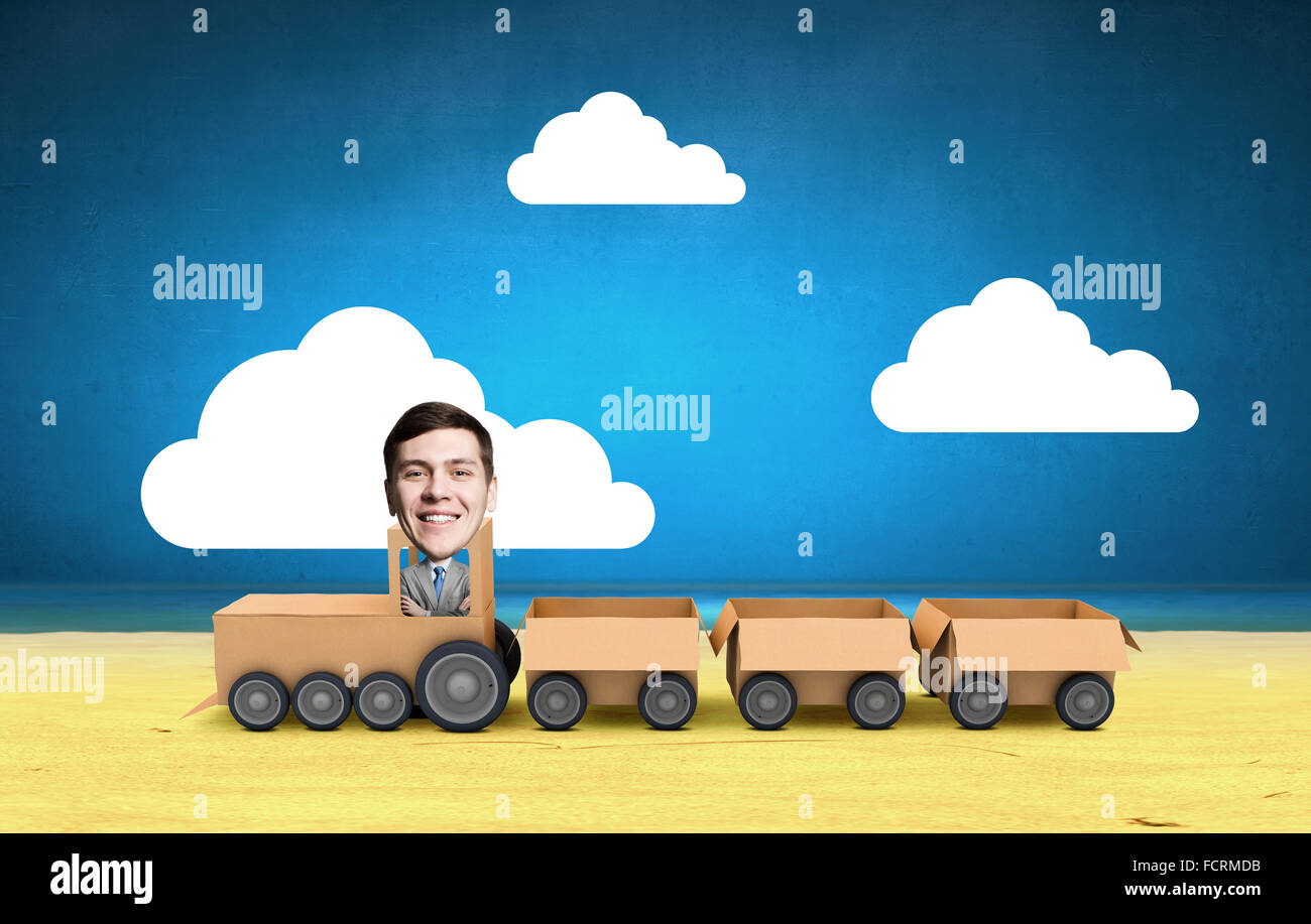 Funny cartoon image of businessman riding carton box Stock Photo - Alamy