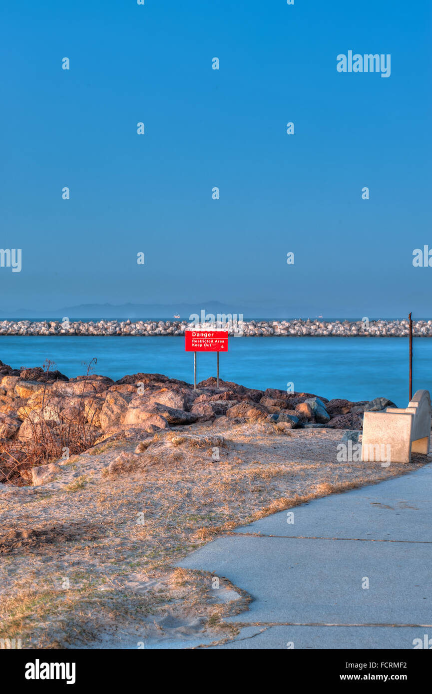 Danger sign on the jetty Stock Photo - Alamy
