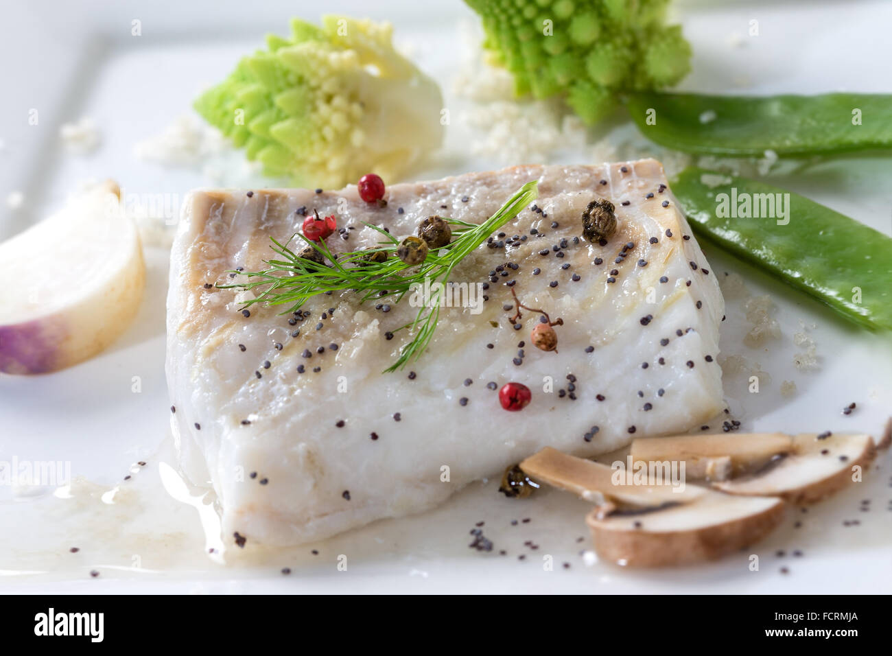 Steamed Atlantic Cod fish with spices and vegetable Stock Photo - Alamy