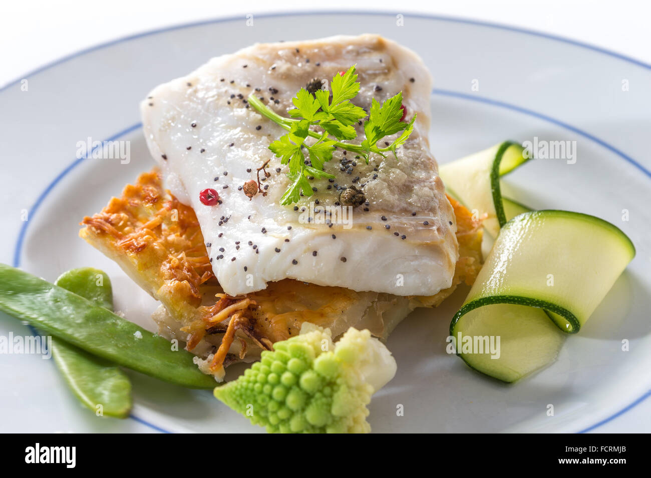 Steamed Atlantic Cod fish with spices and vegetable Stock Photo - Alamy