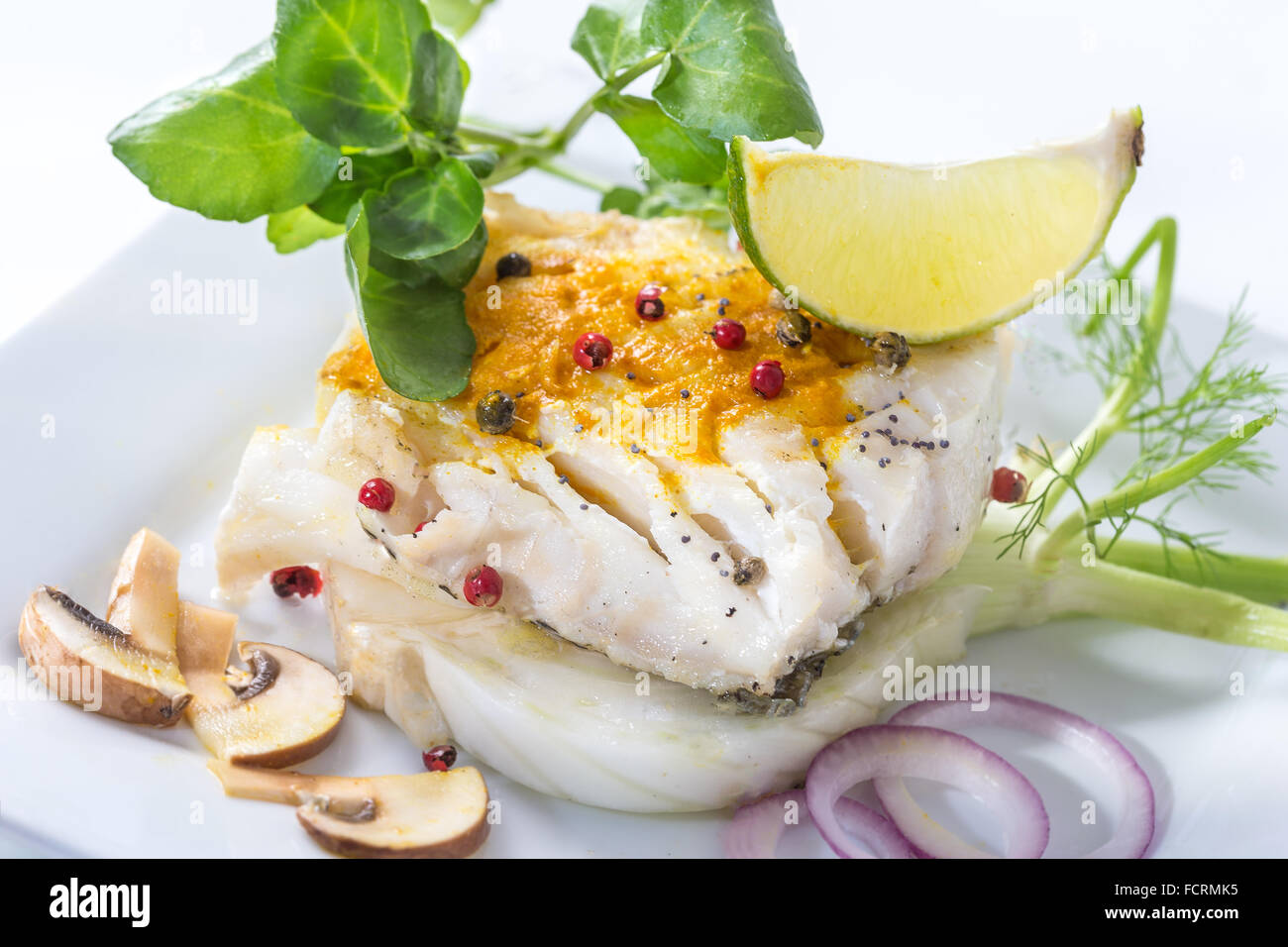 Steamed Atlantic Cod fish with spices and vegetable Stock Photo - Alamy
