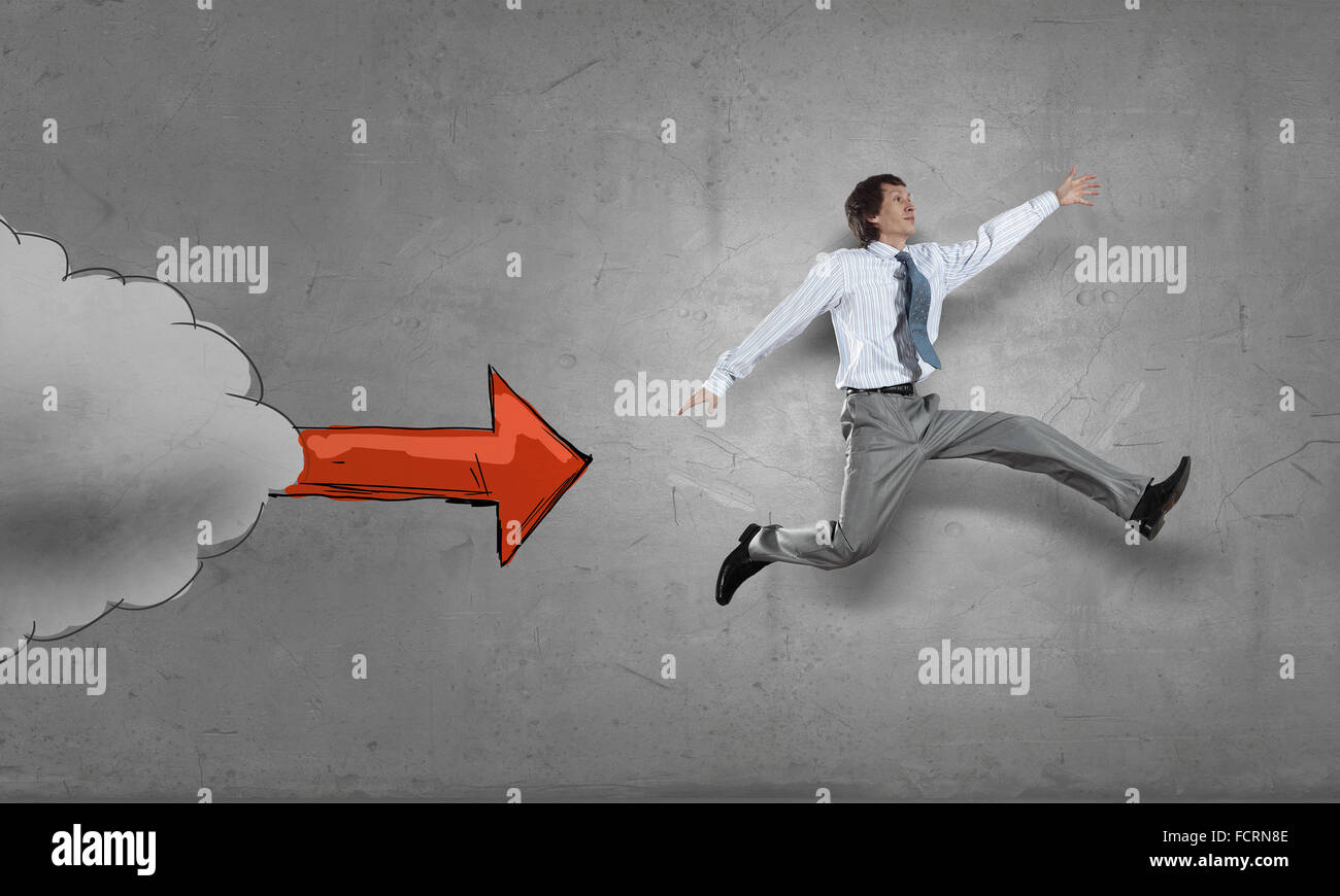 Young speedy businessman running in a hurry Stock Photo - Alamy