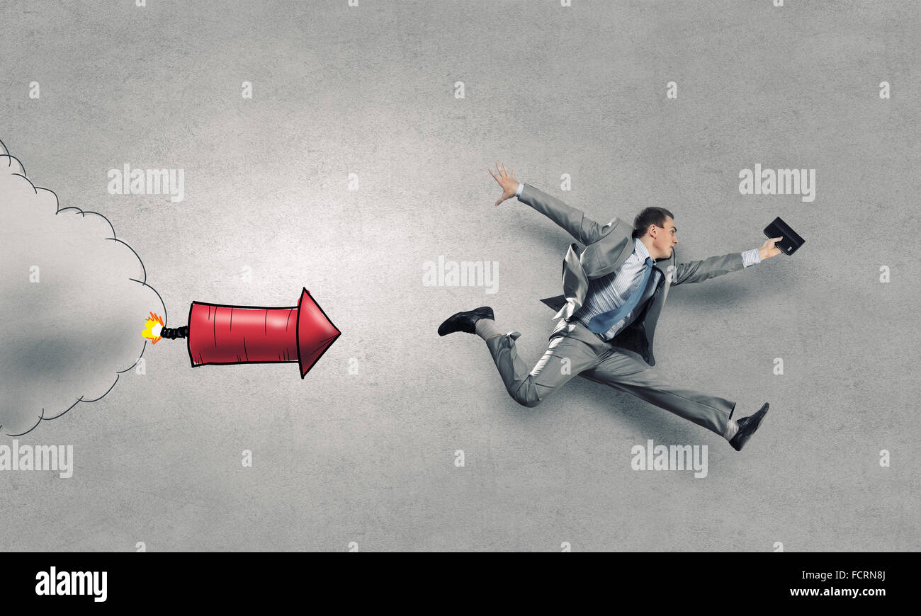 Young speedy businessman running in a hurry Stock Photo - Alamy