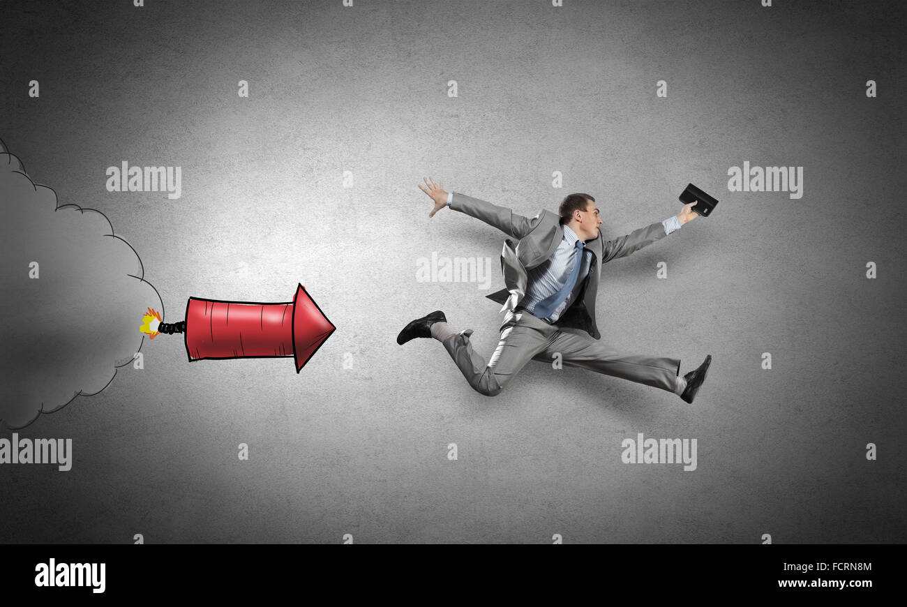 Young speedy businessman running in a hurry Stock Photo - Alamy