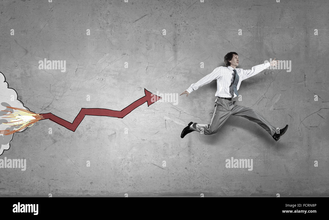 Young speedy businessman running in a hurry Stock Photo - Alamy