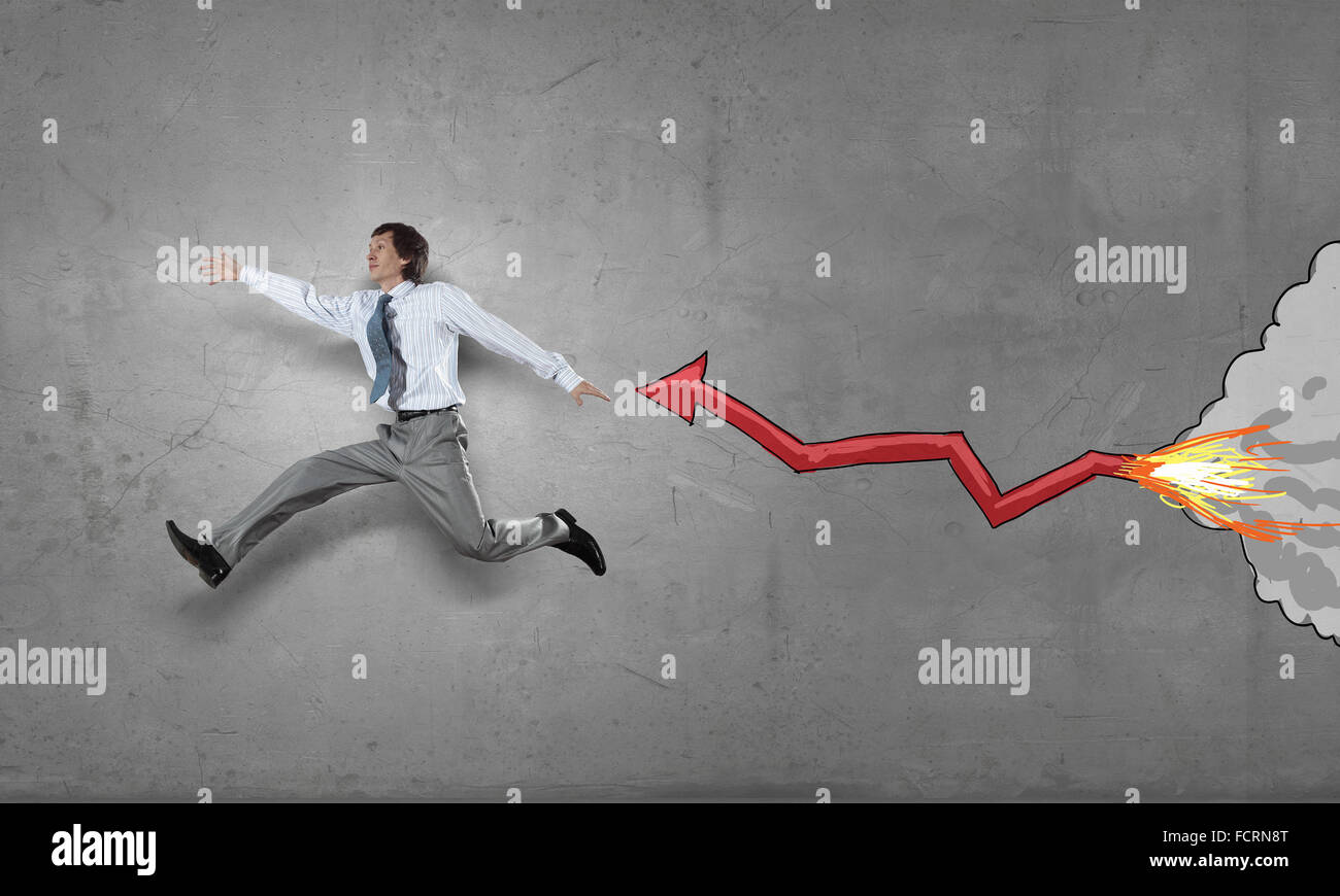 Young speedy businessman running in a hurry Stock Photo - Alamy