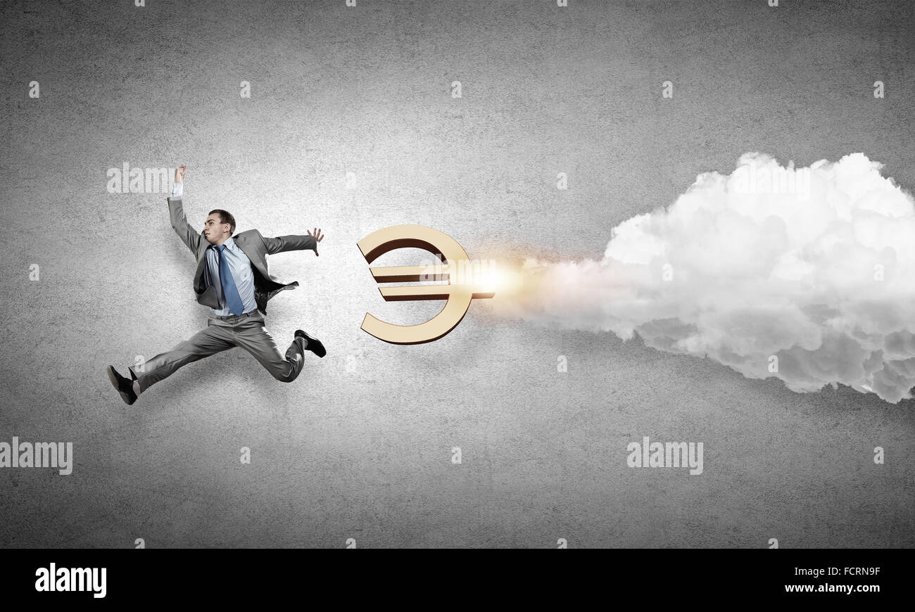 Young speedy businessman running in a hurry Stock Photo - Alamy