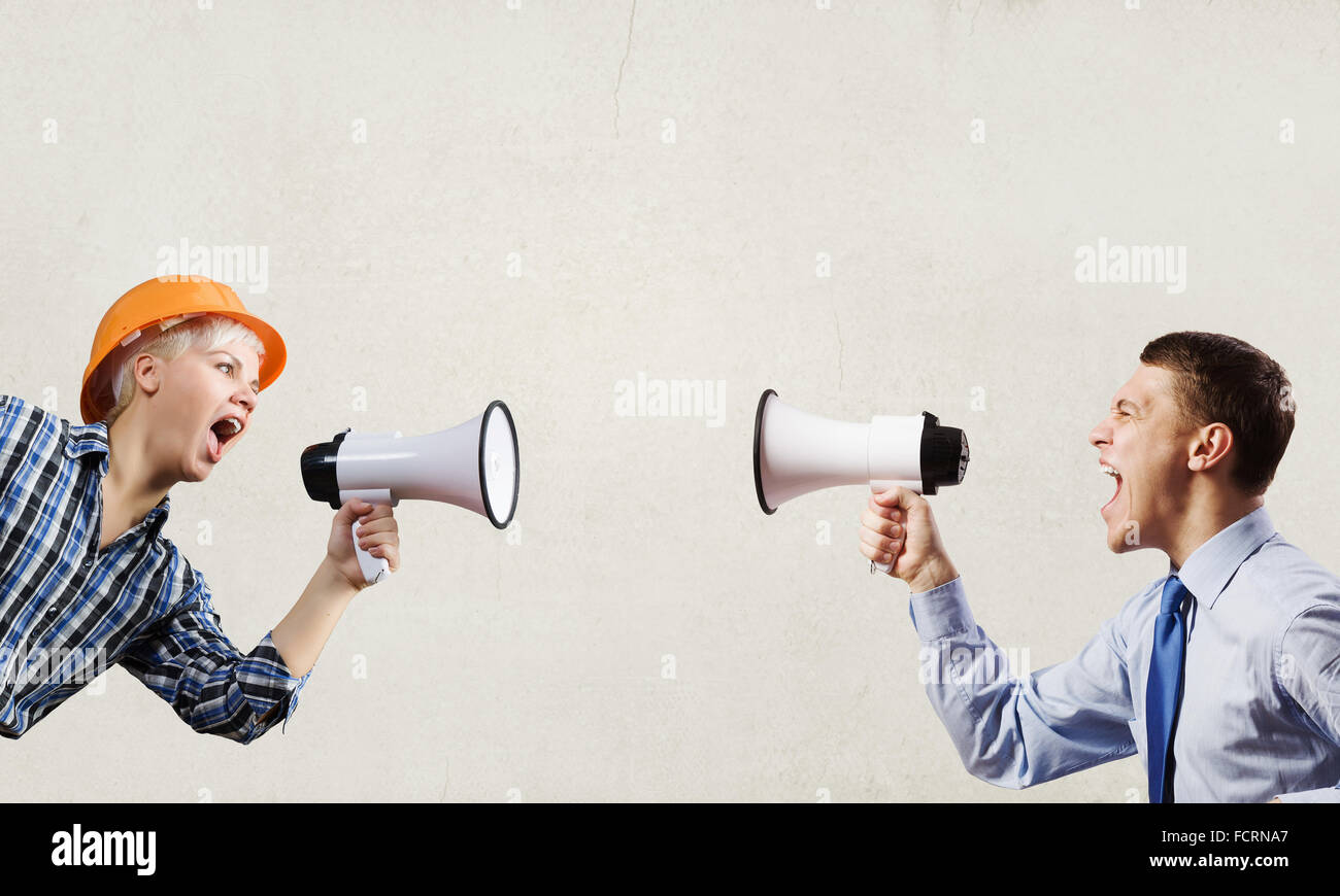 Young furious people screaming agressively in megaphone Stock Photo - Alamy