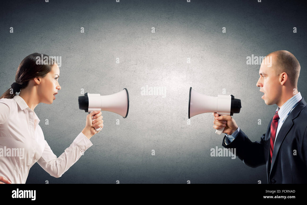 Young furious people screaming agressively in megaphone Stock Photo - Alamy