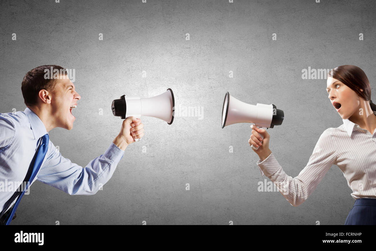 Young furious people screaming agressively in megaphone Stock Photo - Alamy