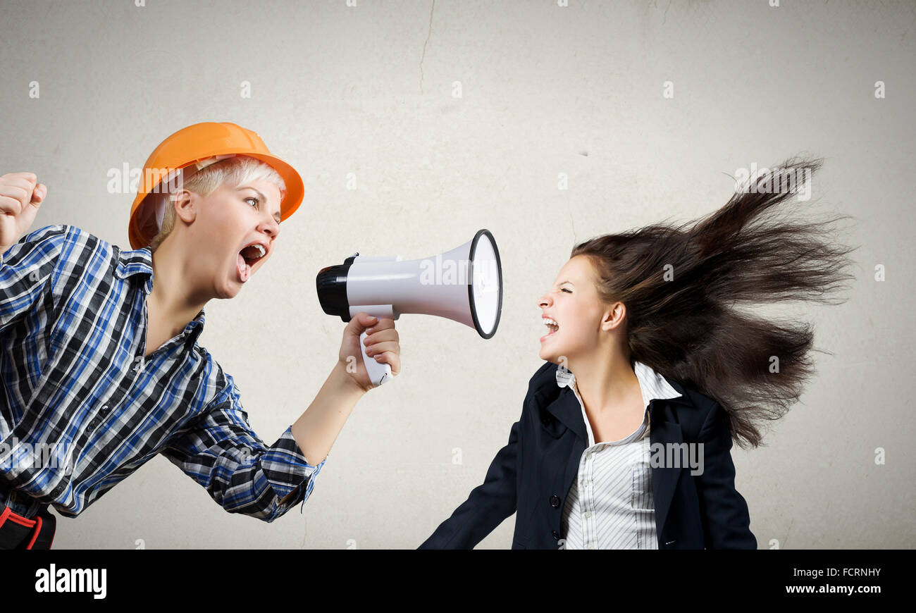 Young furious woman screaming agressively in megaphone Stock Photo - Alamy