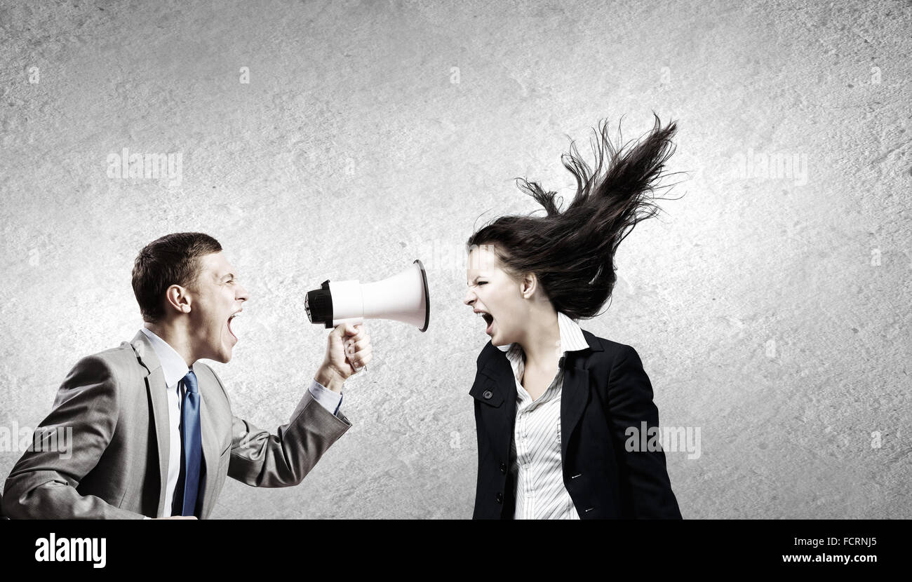 Young furious people screaming agressively in megaphone Stock Photo - Alamy