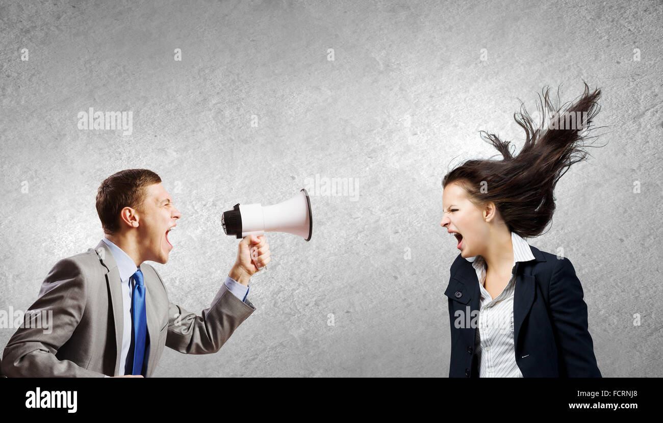 Young furious people screaming agressively in megaphone Stock Photo - Alamy