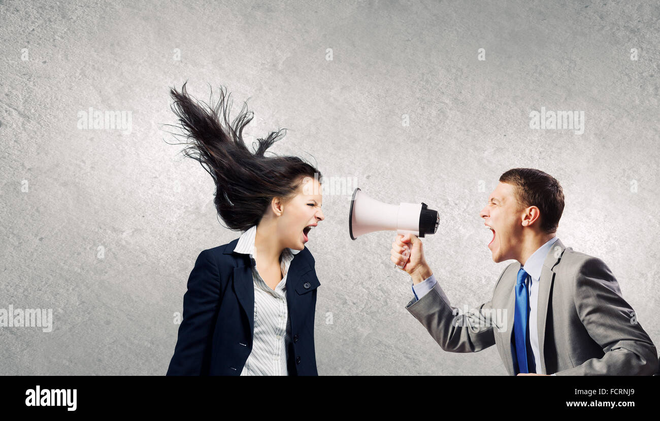 Young furious people screaming agressively in megaphone Stock Photo - Alamy