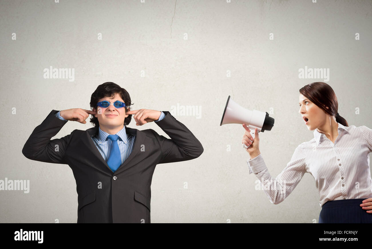 Young furious woman screaming agressively in megaphone Stock Photo - Alamy