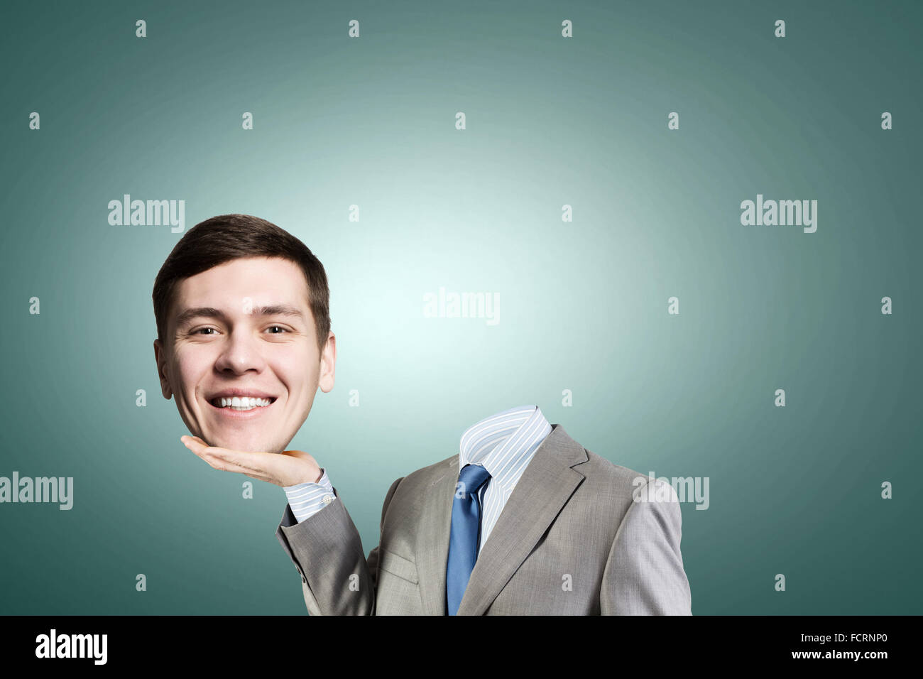 Young headless businesman holding his head in palm Stock Photo - Alamy