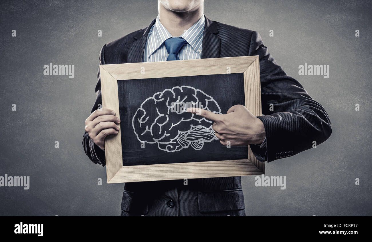 Close up of man holding chalkboard with ideas Stock Photo - Alamy