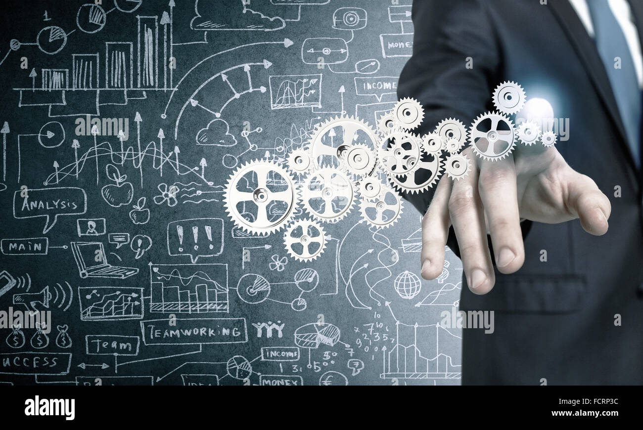 Close businessman touching gear mechanism hi-res stock photography and ...