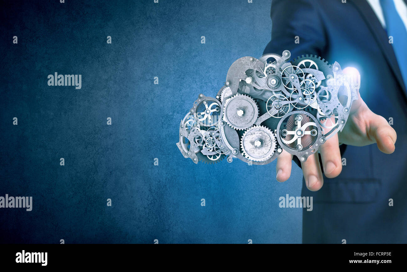 Close up of businessman touching gears mechanism with finger Stock ...