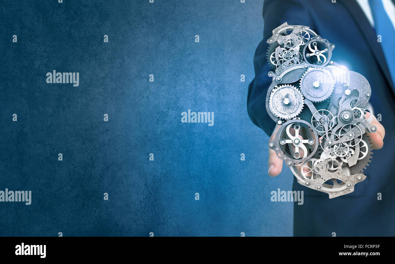 Close up of businessman touching gears mechanism with finger Stock ...