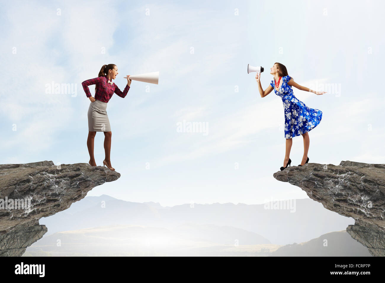 Young people screaming at each other in trumpet Stock Photo - Alamy