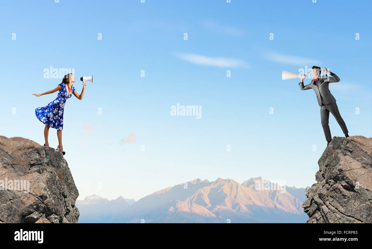 Young people screaming at each other in trumpet Stock Photo - Alamy