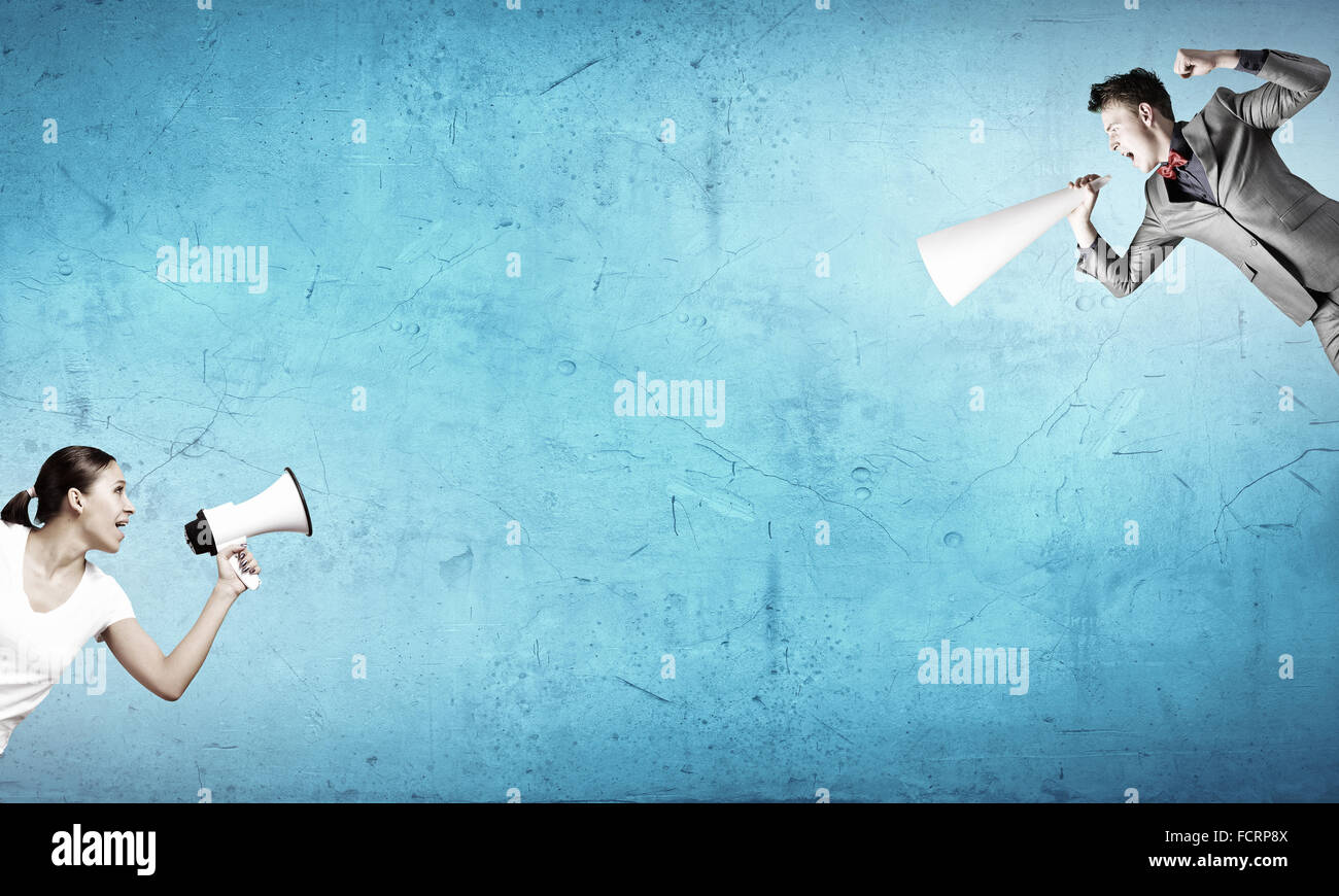 Young people screaming at each other in trumpet Stock Photo - Alamy