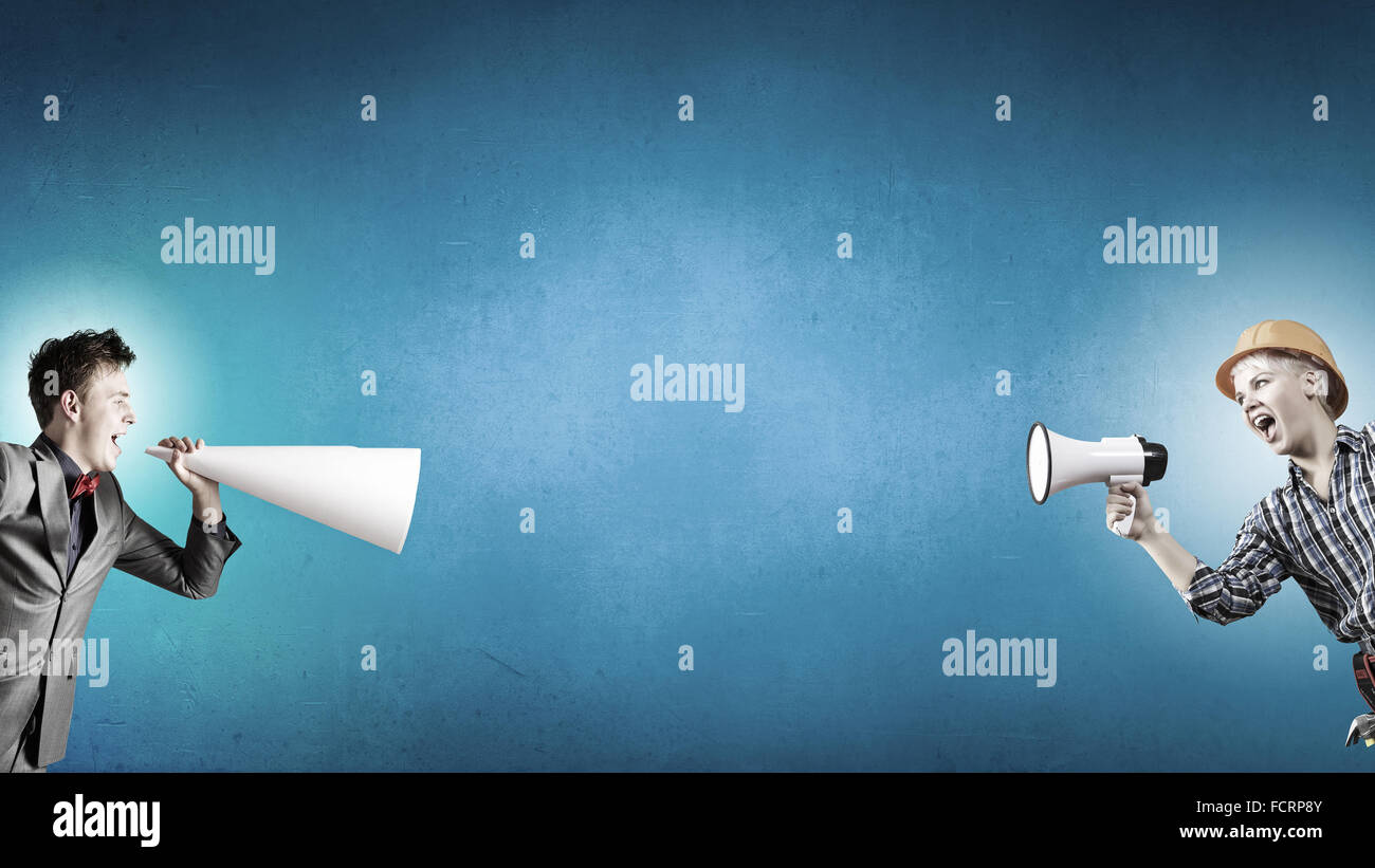 Young people screaming at each other in trumpet Stock Photo - Alamy