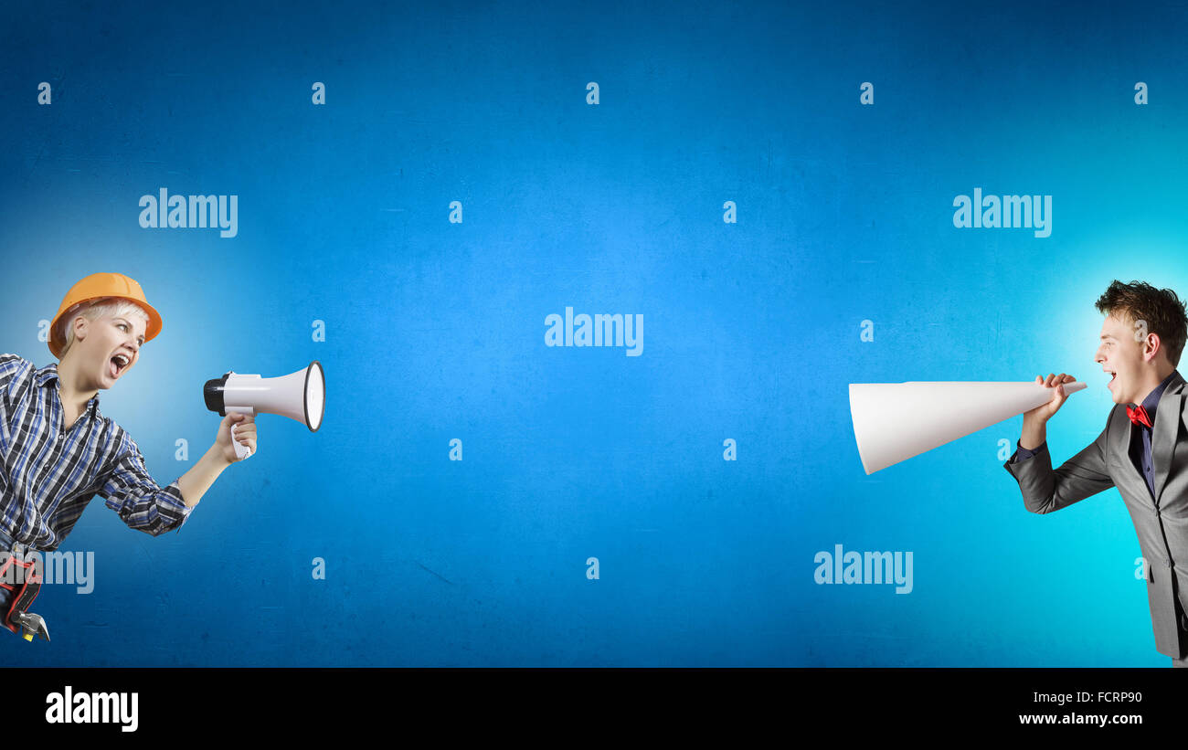 Young people screaming at each other in trumpet Stock Photo - Alamy