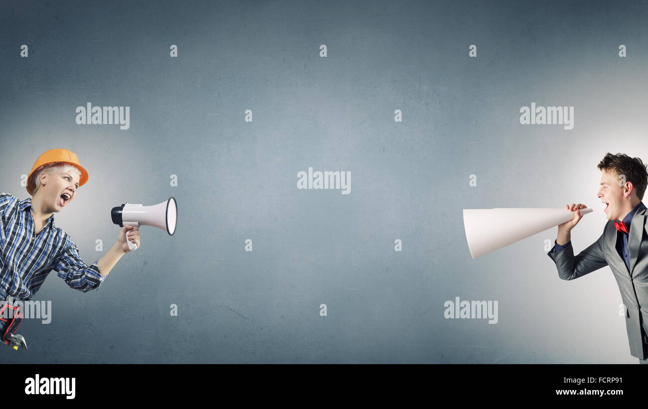 Young people screaming at each other in trumpet Stock Photo - Alamy