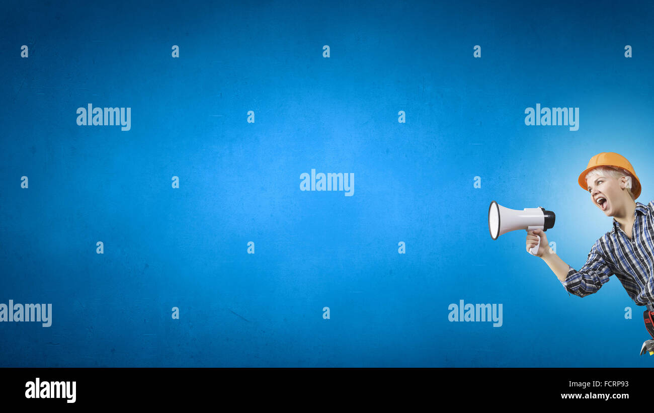 Young woman making some announcement in trumpet Stock Photo - Alamy