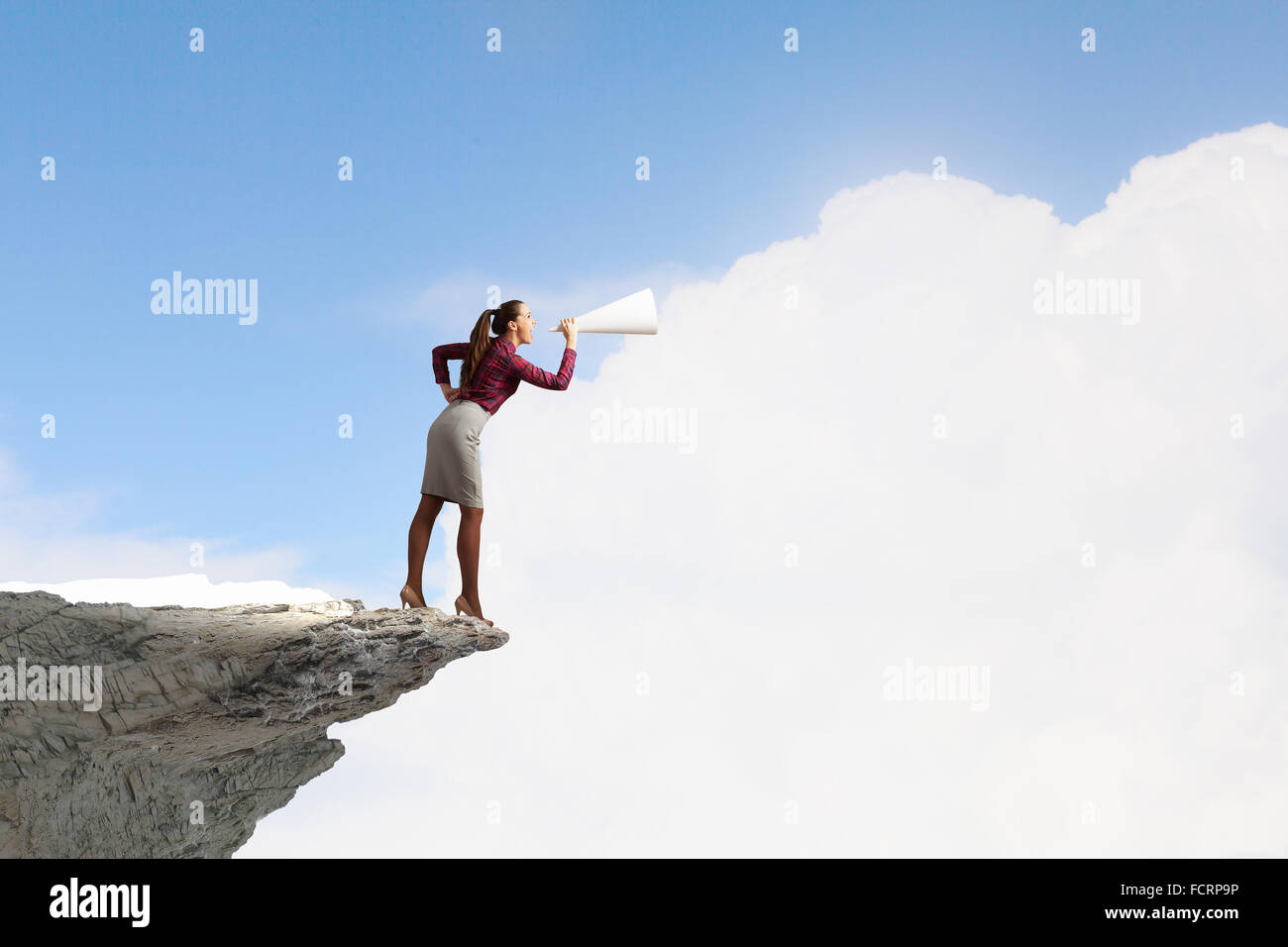 Young woman making some announcement in trumpet Stock Photo - Alamy