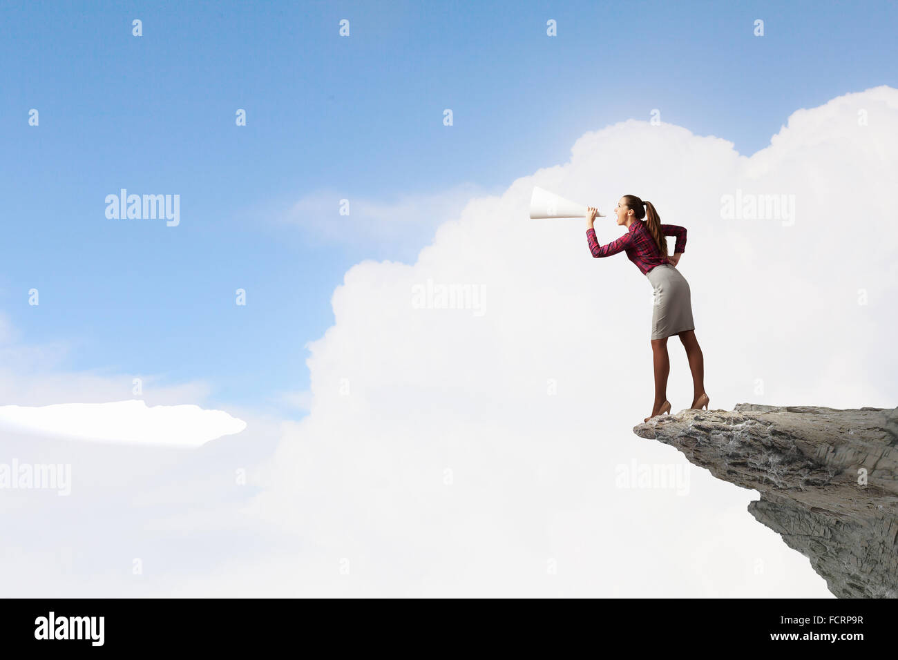 Young woman making some announcement in trumpet Stock Photo - Alamy