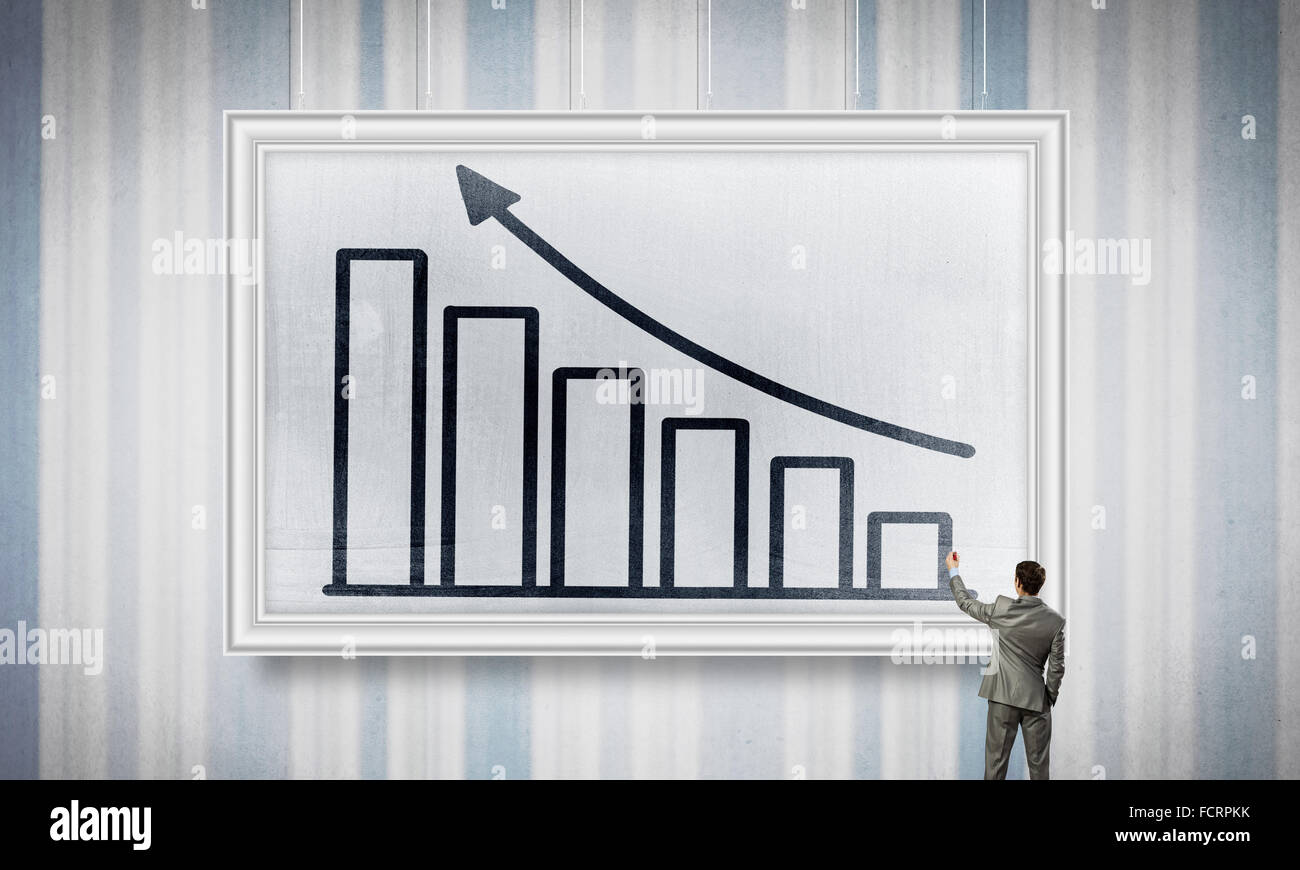 Rear view of businessman drawing business plan on white banner Stock ...
