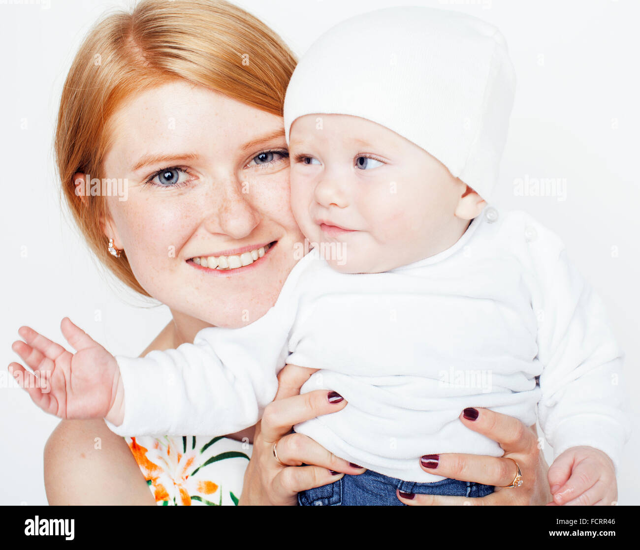 young beauty mother with baby, red head happy family isolated Stock ...