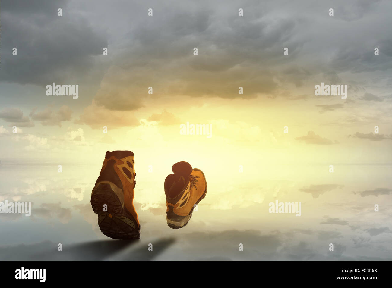 Pair of hikers boots walking on path Stock Photo - Alamy