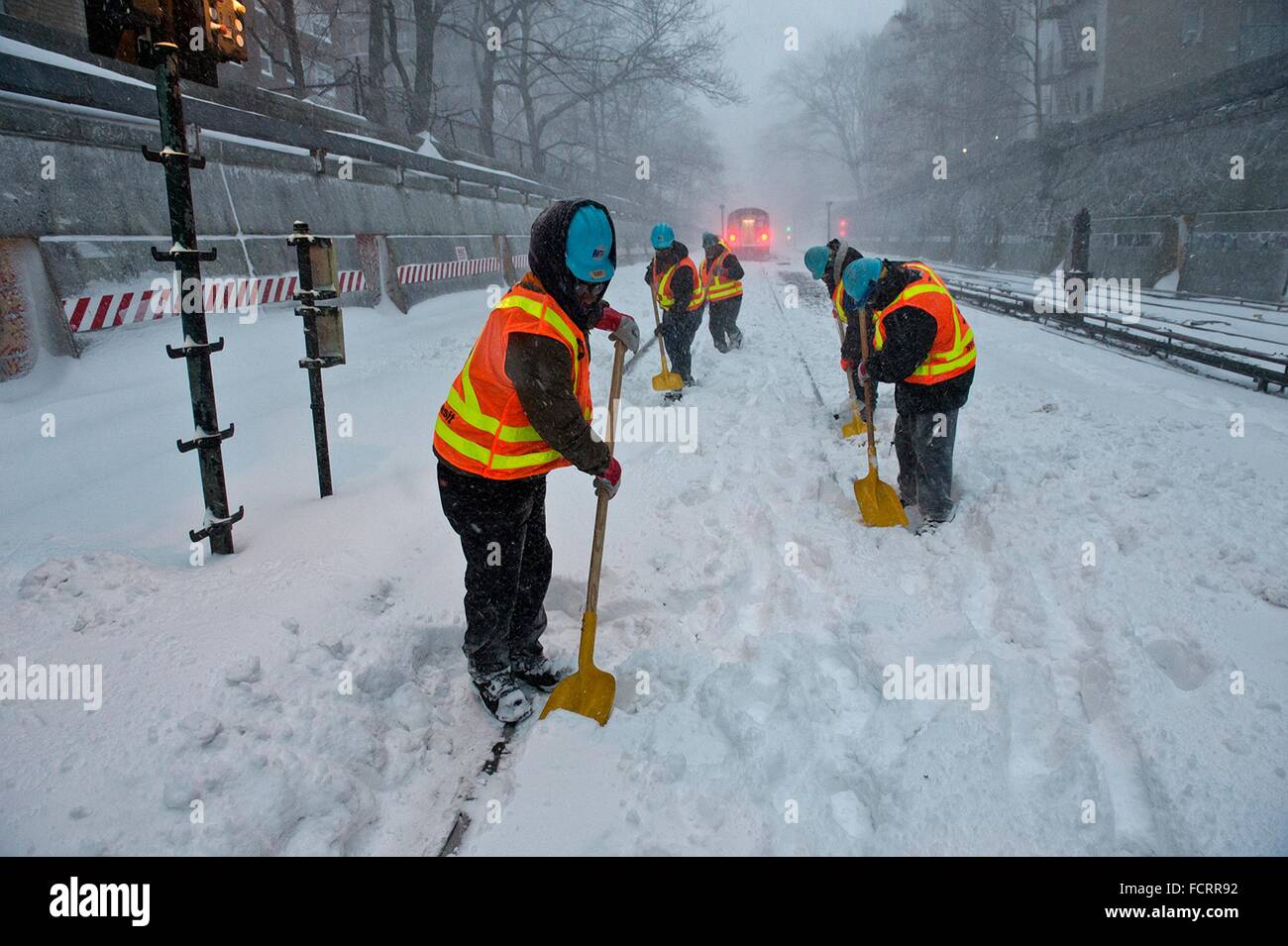 New York, USA. 24th January, 2016. MTA workers clear snow from the MTA ...