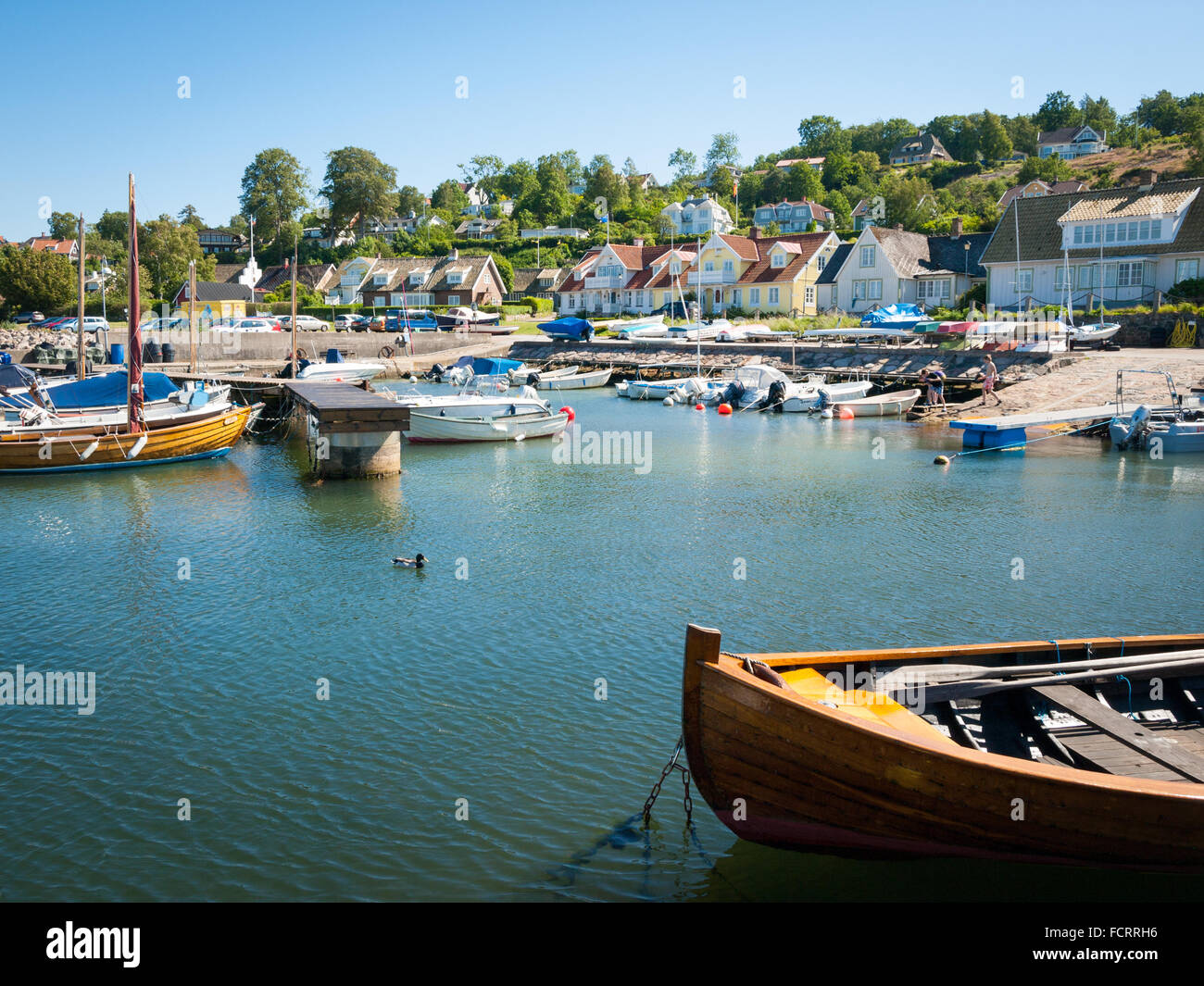 The small, picturesque harbour of the village of Arild, Sweden Stock ...