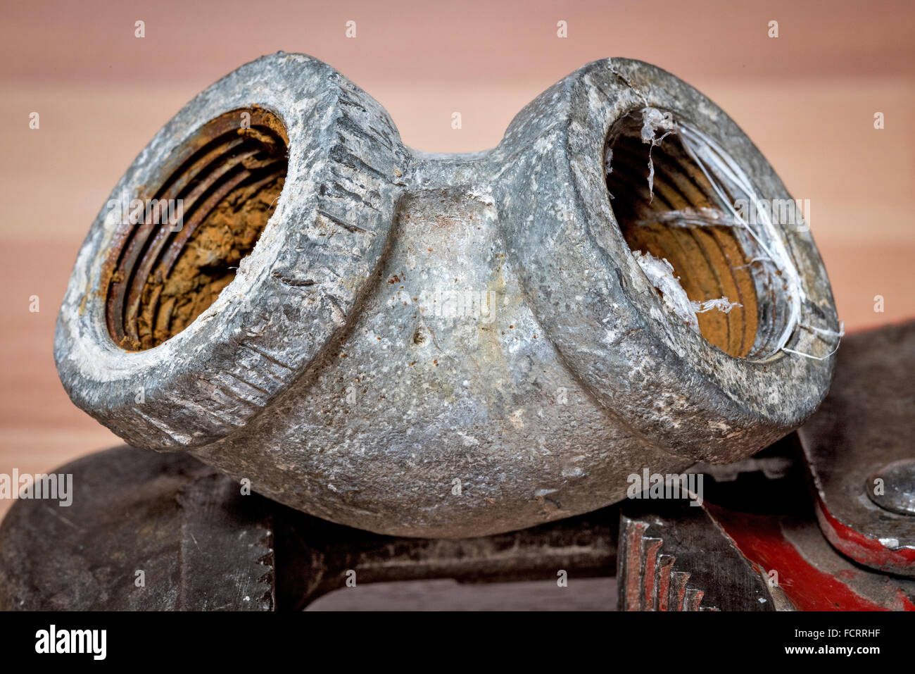 Old corroded pipe elbow close up Stock Photo - Alamy