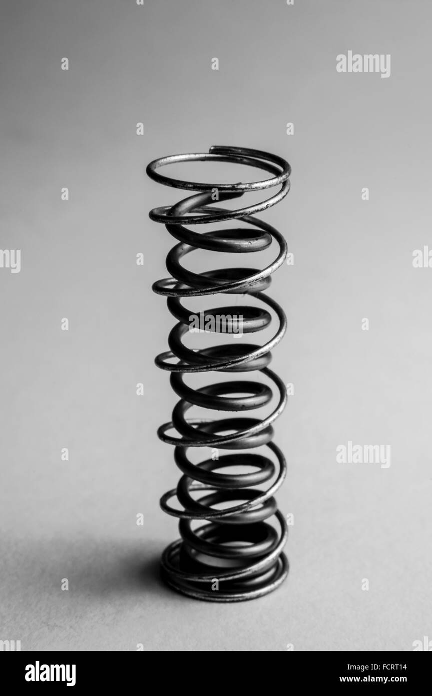 Two Intertwined Metal Springs Stock Photo - Alamy