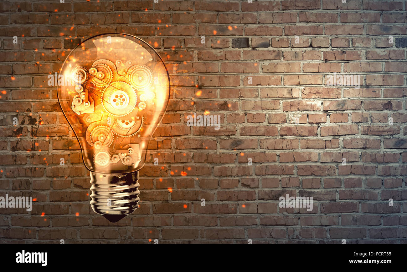 Concept of mechanism light bulb with gears inside Stock Photo - Alamy