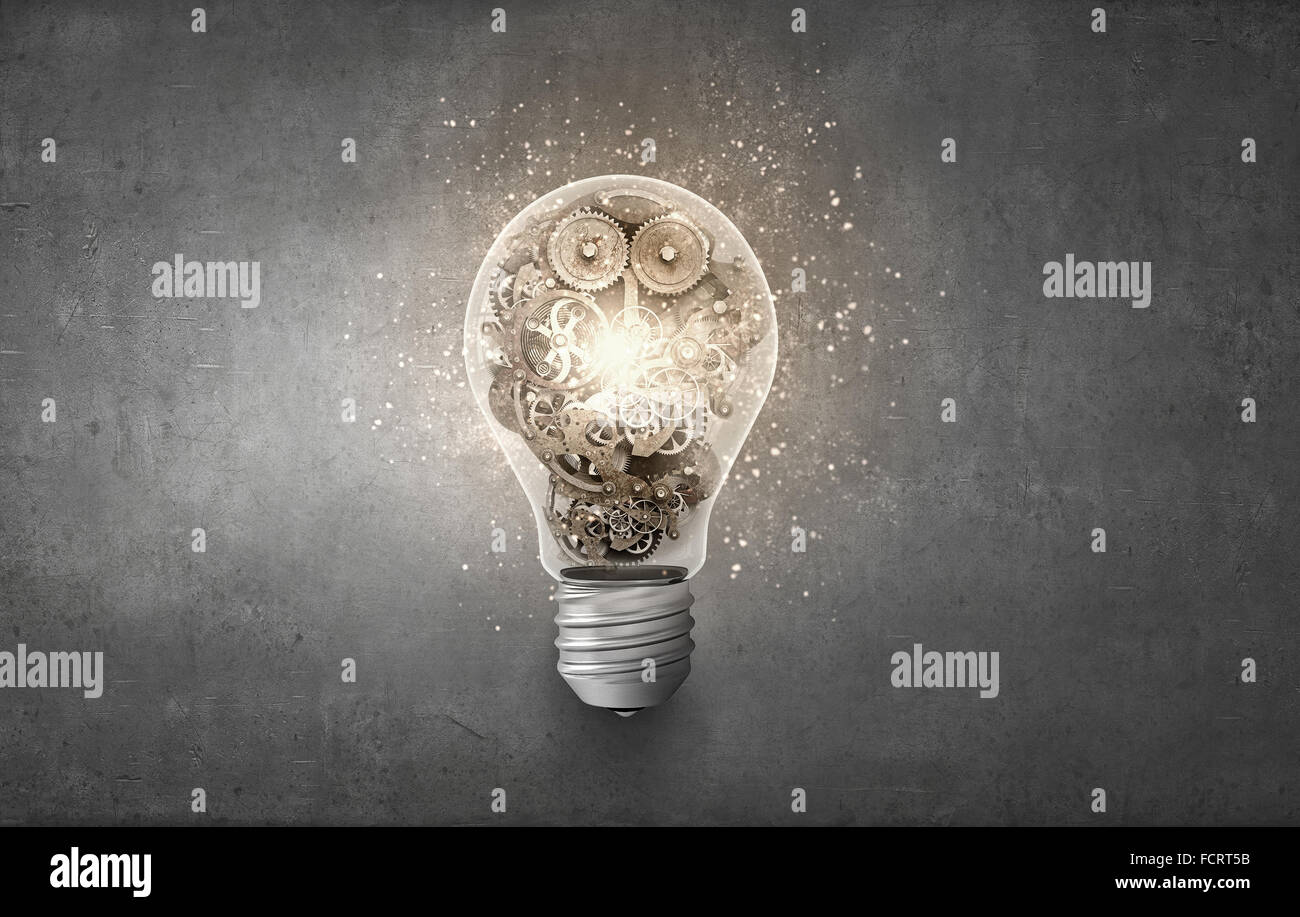 Concept of mechanism light bulb with gears inside Stock Photo - Alamy