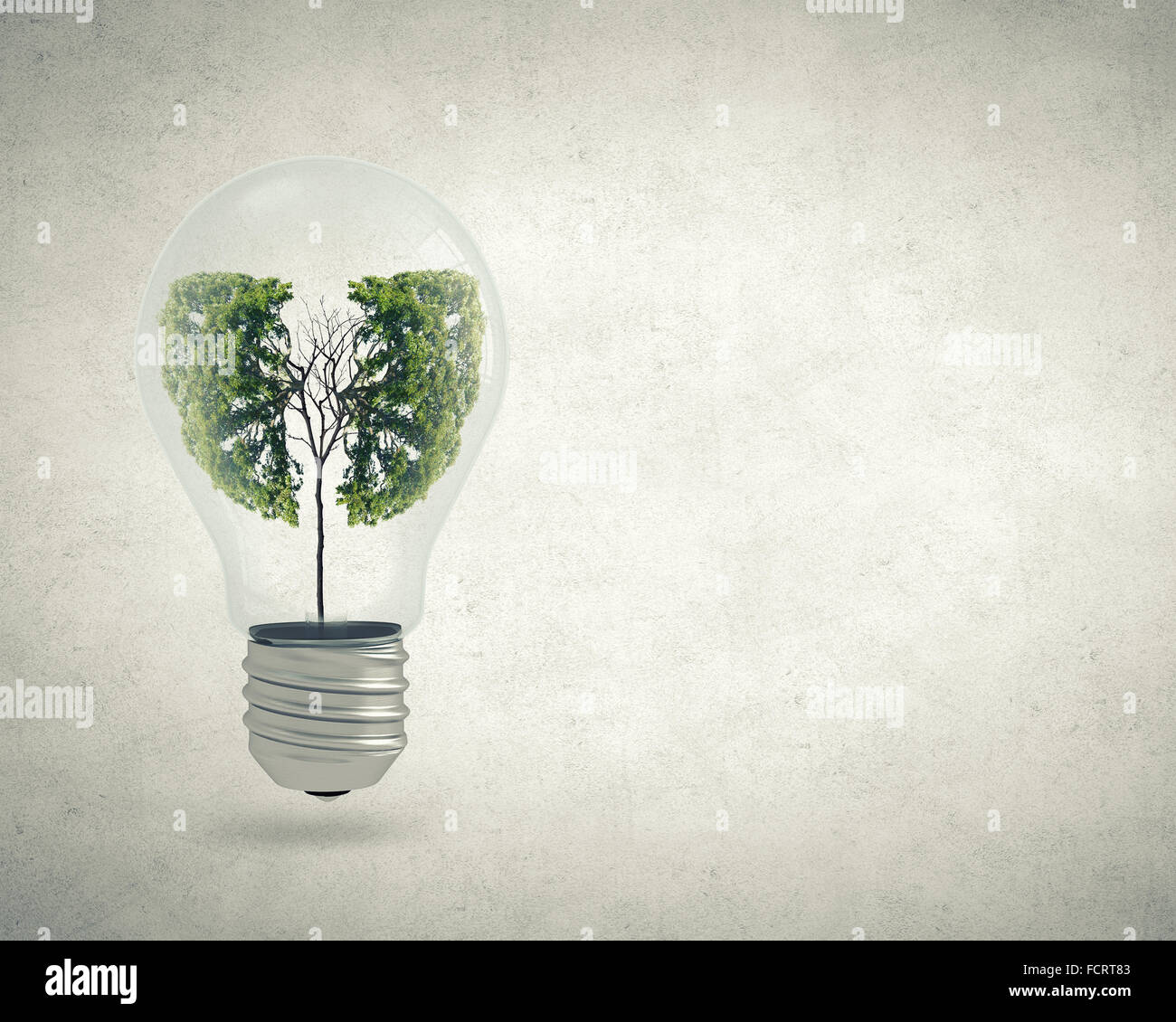 Ecology concept with green tree inside of light bulb Stock Photo - Alamy