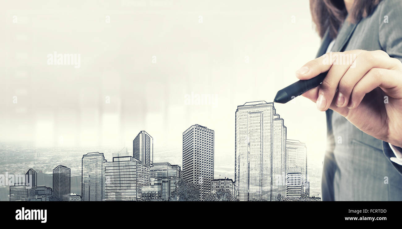 Close up of human hand drawing construction project Stock Photo - Alamy