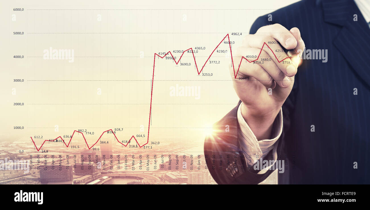 Close up of businessman drawing increasing graph with marker Stock ...